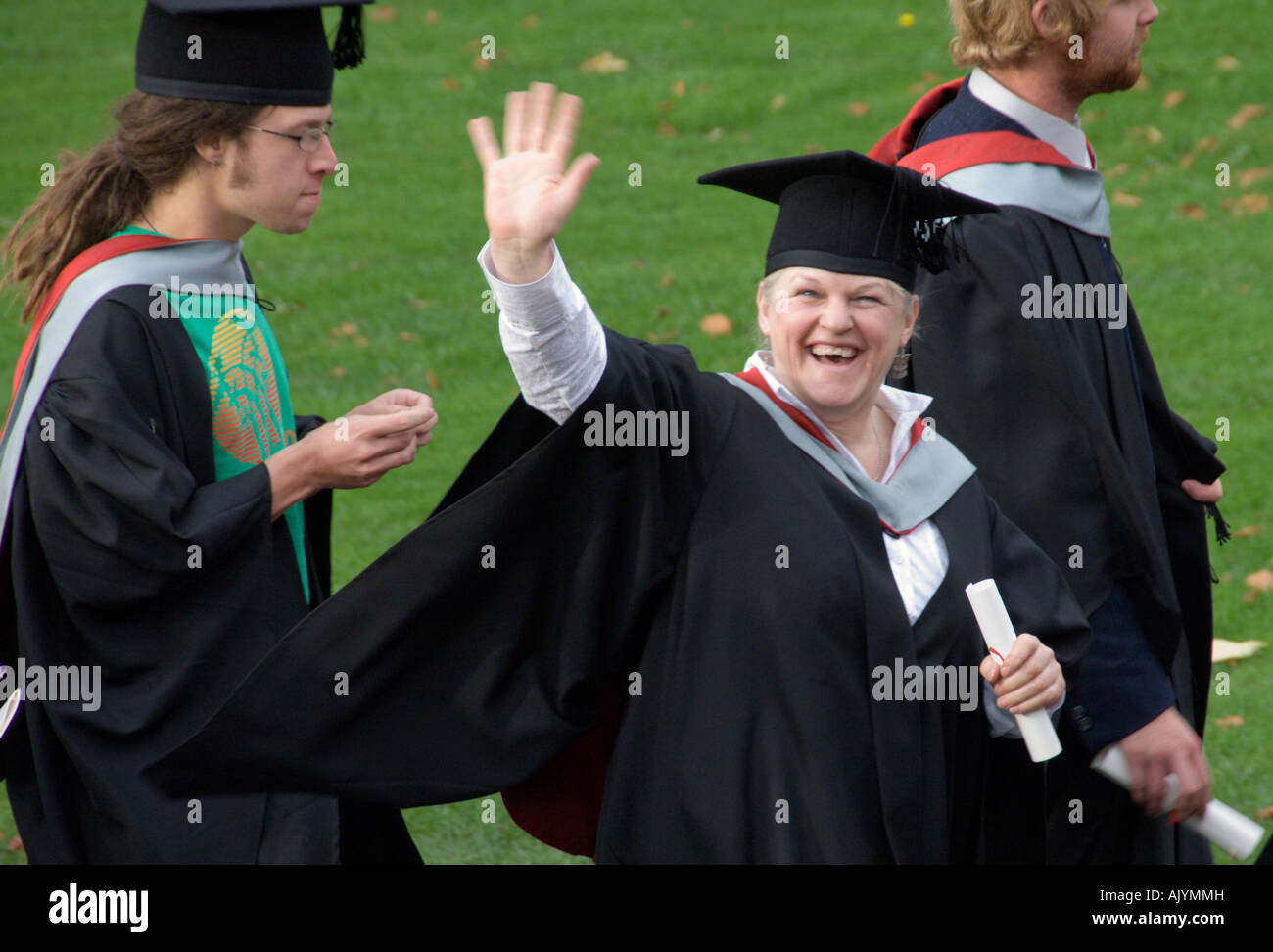 Masters student University of Cumbria waving happily after graduation ...