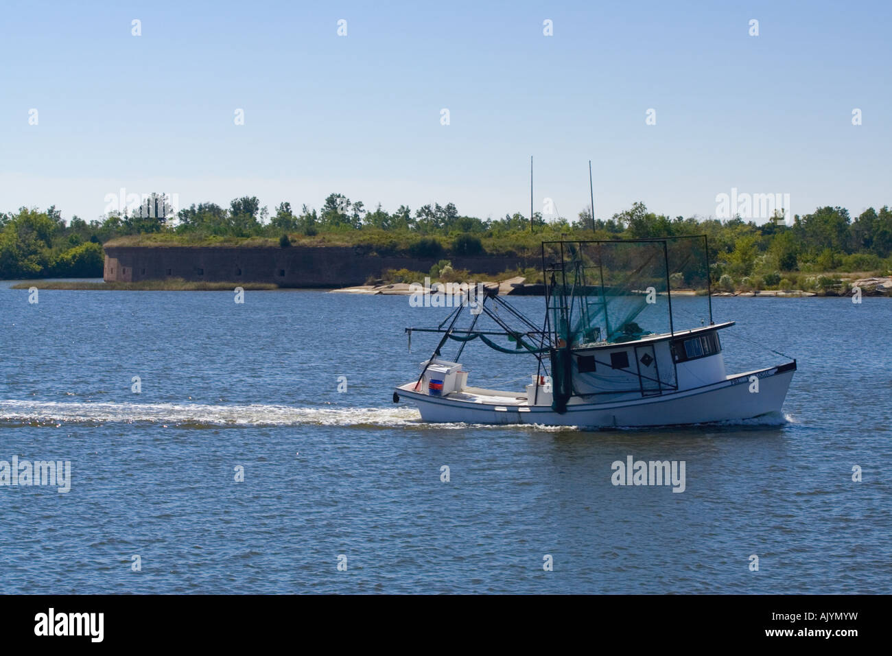 Shrimp boat passing the ruins of Fort Macomb originally Fort Wood at ...