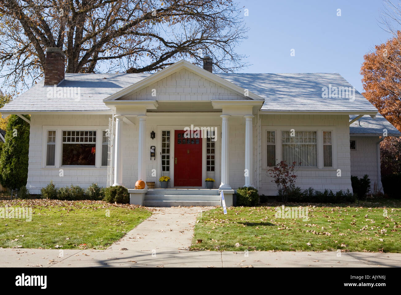 Cute small white vintage house in the fall Stock Photo - Alamy