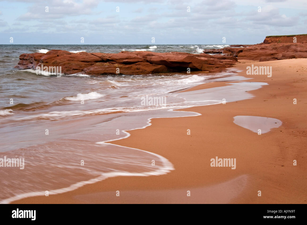Red rocks and surf along Campbell's Cove beach, Campbell's Cove, PE/PEI ...
