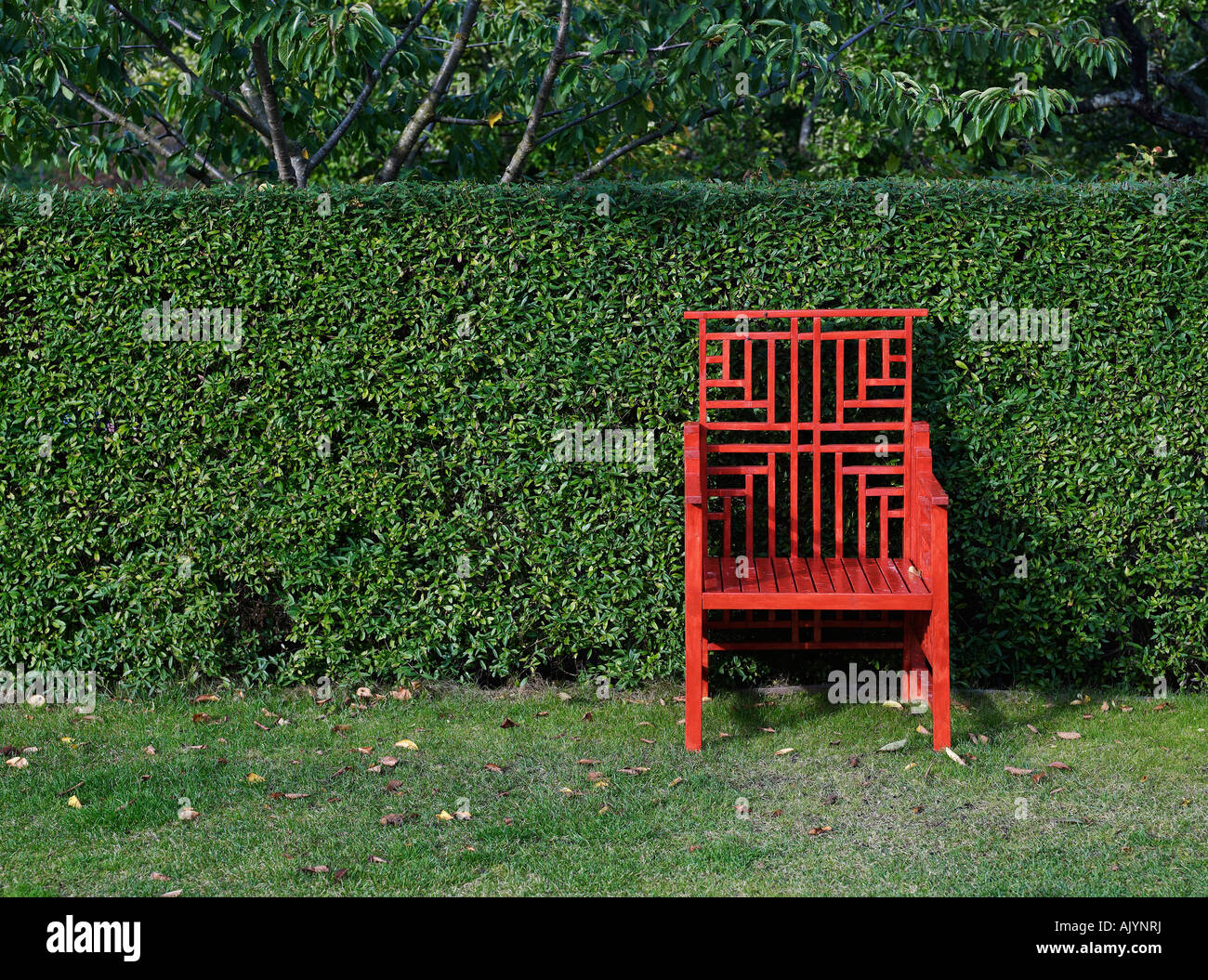 red chair outside in the garden Stock Photo - Alamy