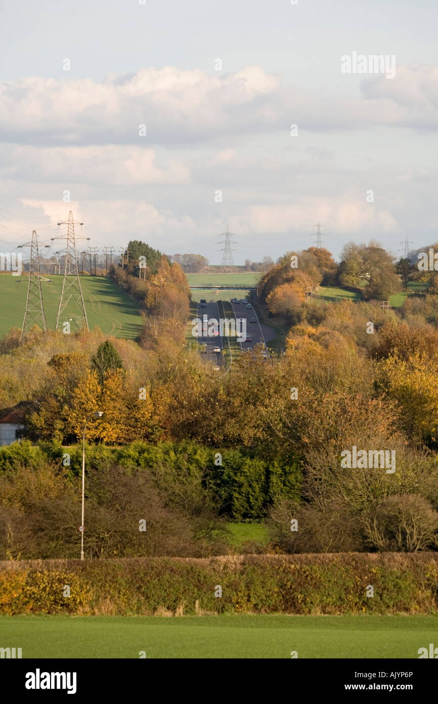 Countryside road pylon field Stock Photo - Alamy
