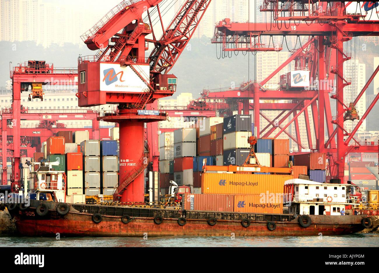 Containers full of exports being positioned to load on to ocean going ...