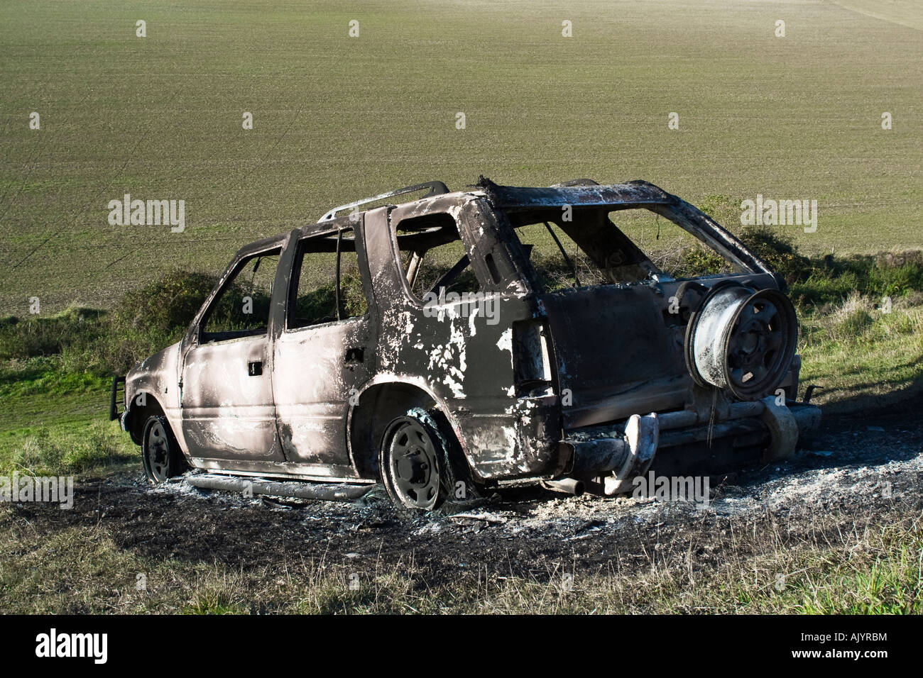 Burnt out car in field hi-res stock photography and images - Alamy
