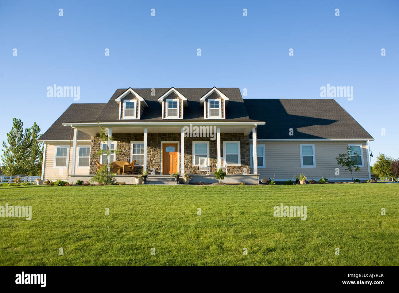 Large modern country home in the summertime Stock Photo - Alamy