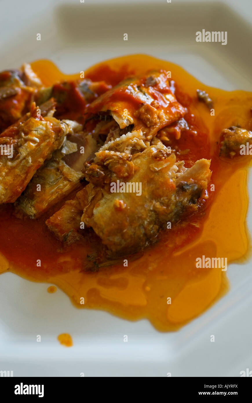 Oily Fish on white plate Stock Photo - Alamy