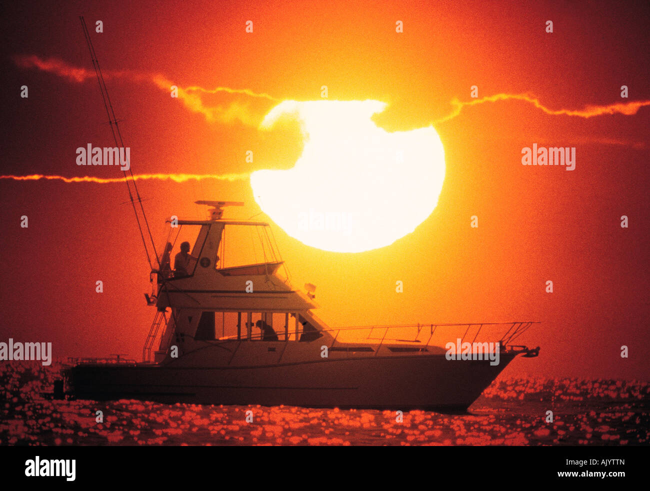 Luxury motor boat at sea. Sunset montage Stock Photo - Alamy