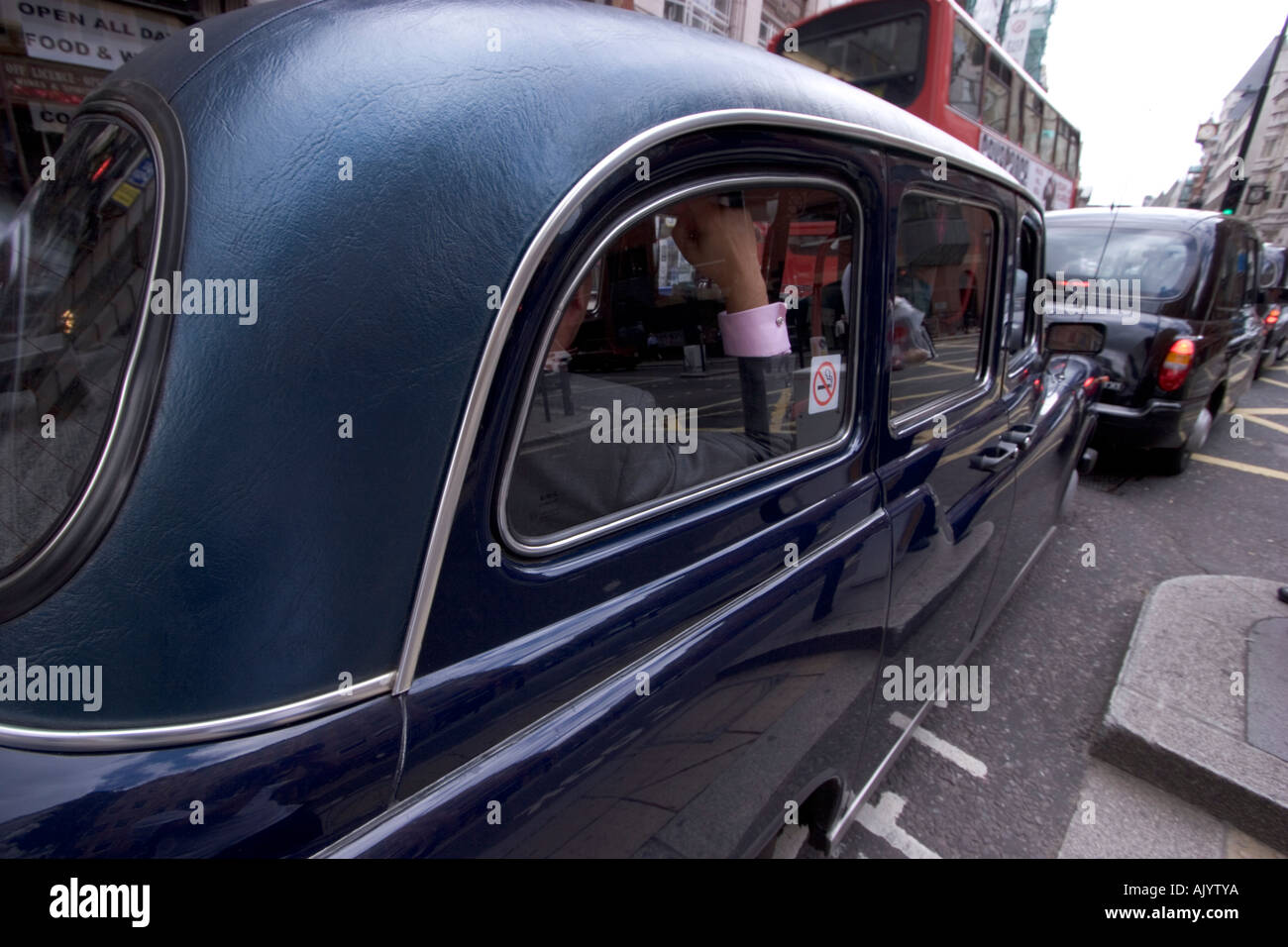 Taxi black cab with passenger central London UK Stock Photo - Alamy