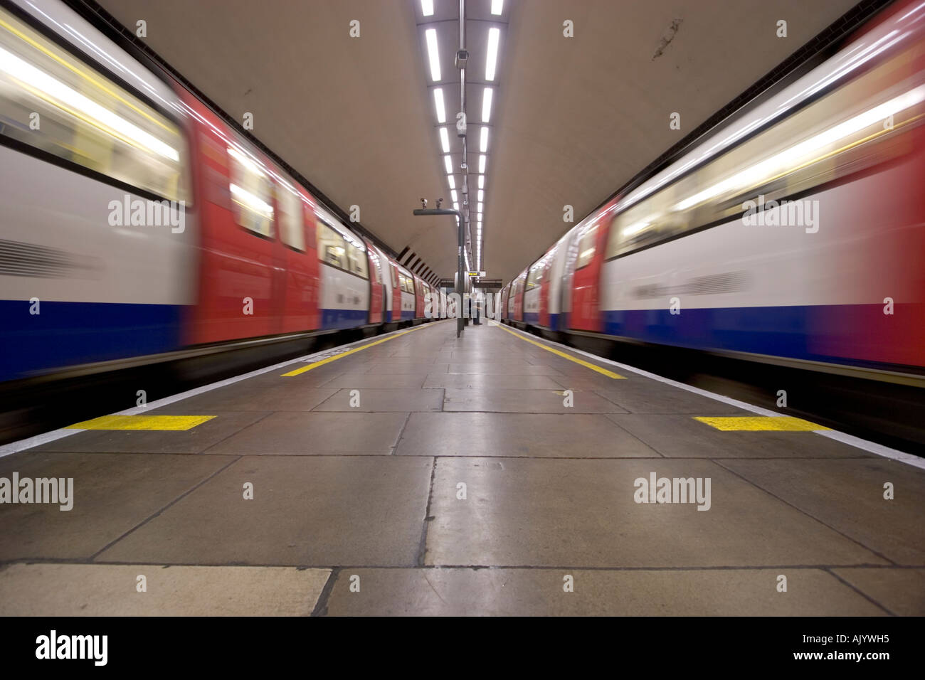 Two London Underground trains on tube network trains arriving and ...