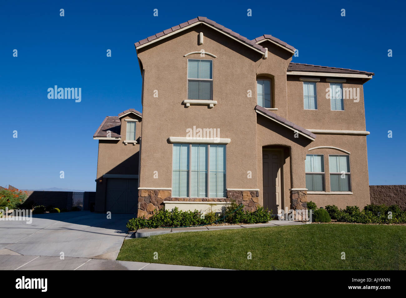 Tan stucco modern home in southwest climate Stock Photo - Alamy