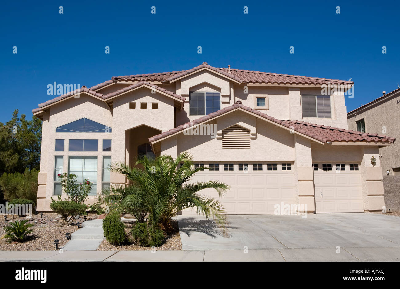 Tan stucco modern home in southwest climate Stock Photo - Alamy