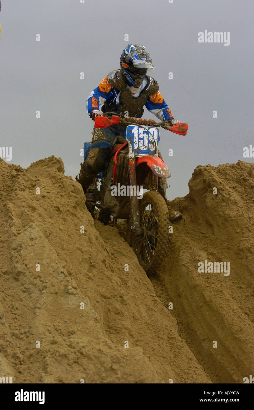A sand-encrusted rider at the Weston Beach Race,Somerset, England. UK ...