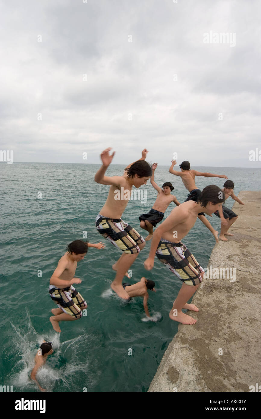 Sequenced jump into lake Stock Photo - Alamy