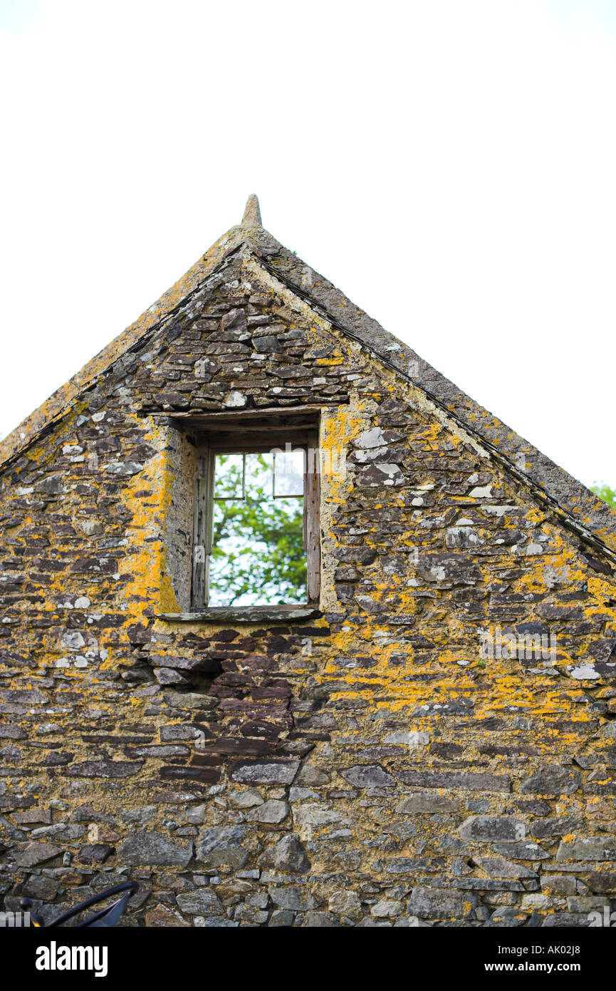 Gable end and window of a stone cottage Stock Photo - Alamy
