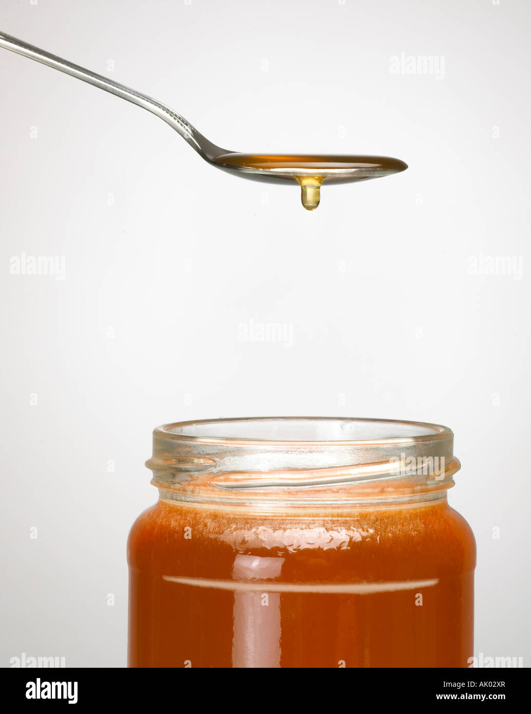 Honey drip spoon hi-res stock photography and images - Alamy
