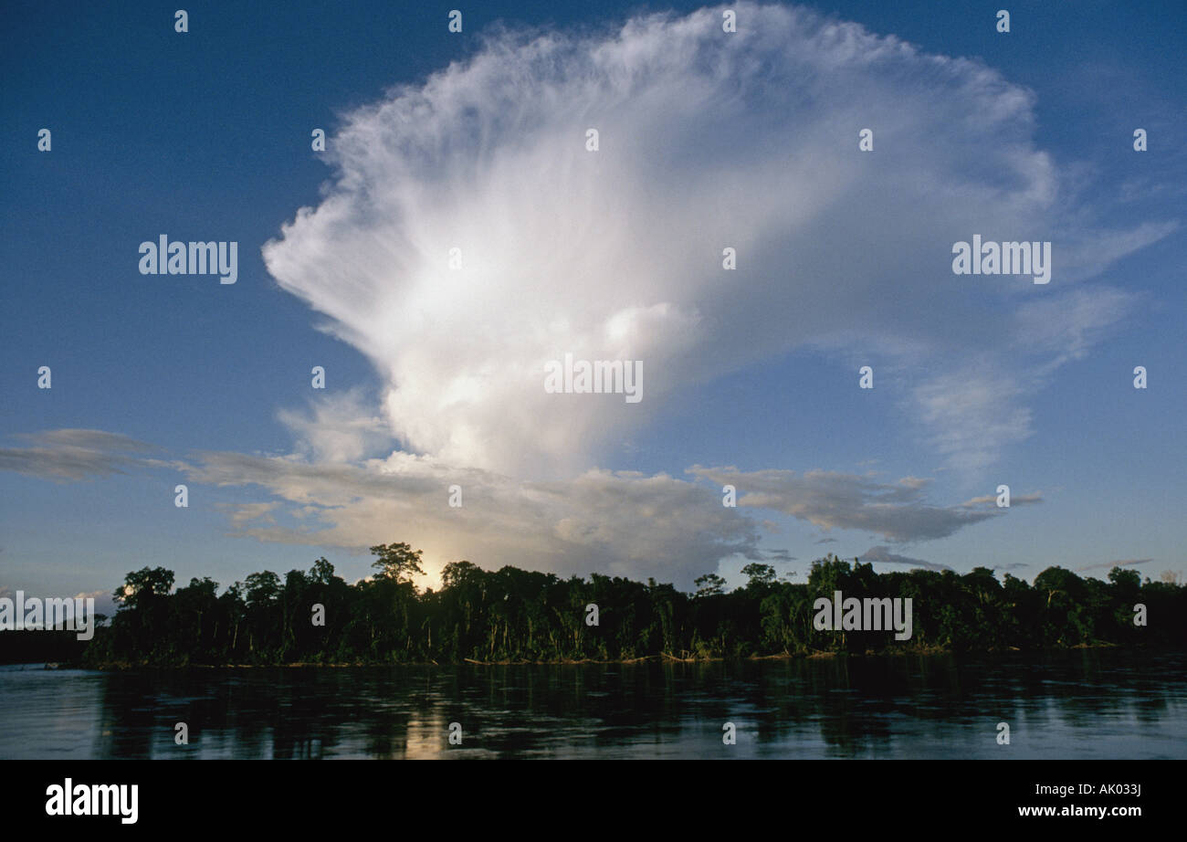 A giant rain cloud forms over the deep rain forest on the upper Amazon ...