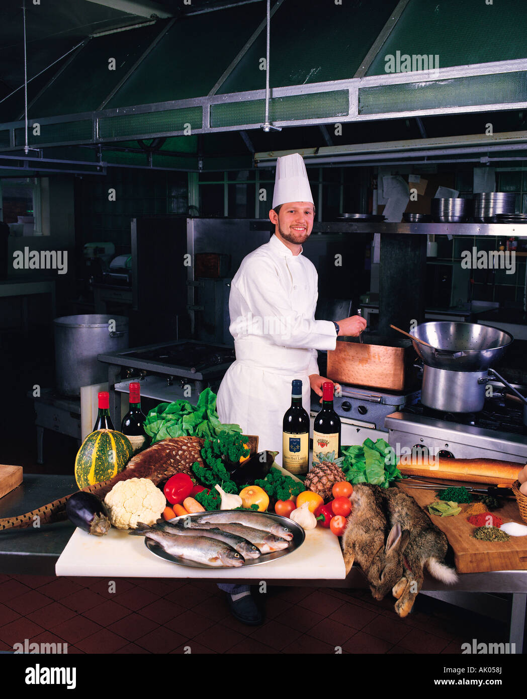 Professional Chef in Hotel Kitchen with display of fresh local produce ...