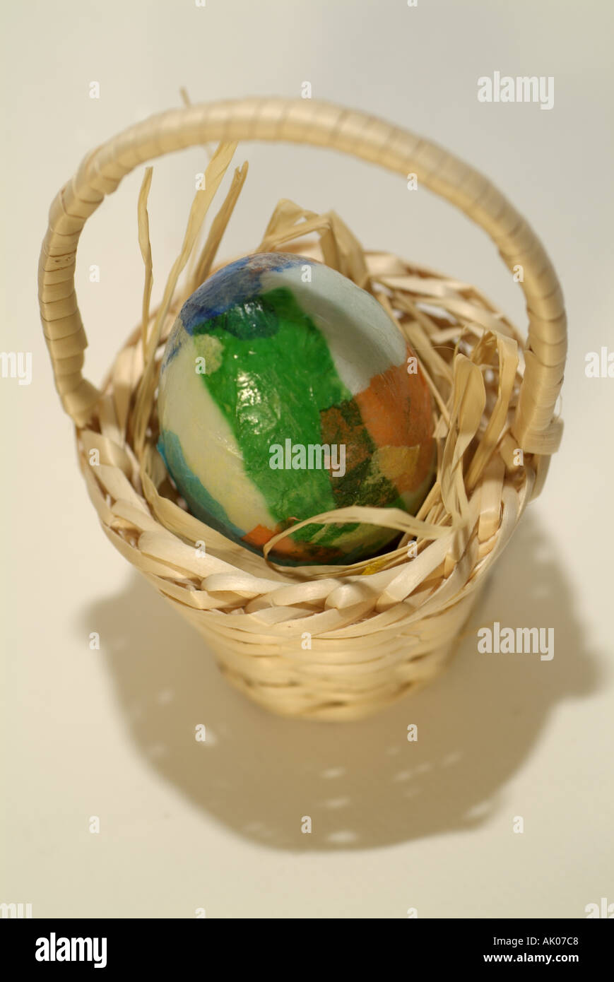 One egg in a straw basket Stock Photo - Alamy