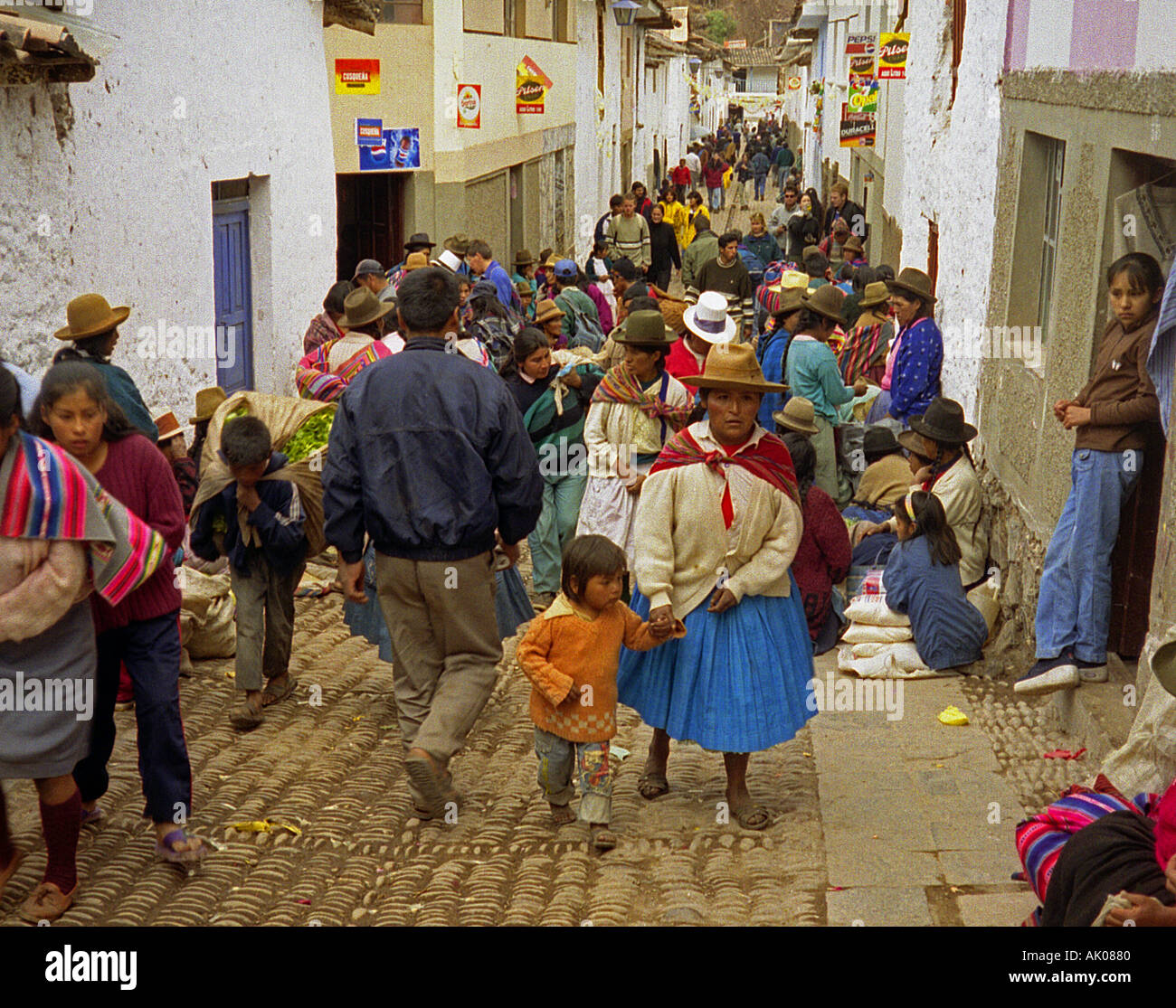 Indigenous people in traditional clothing march through streets after ...