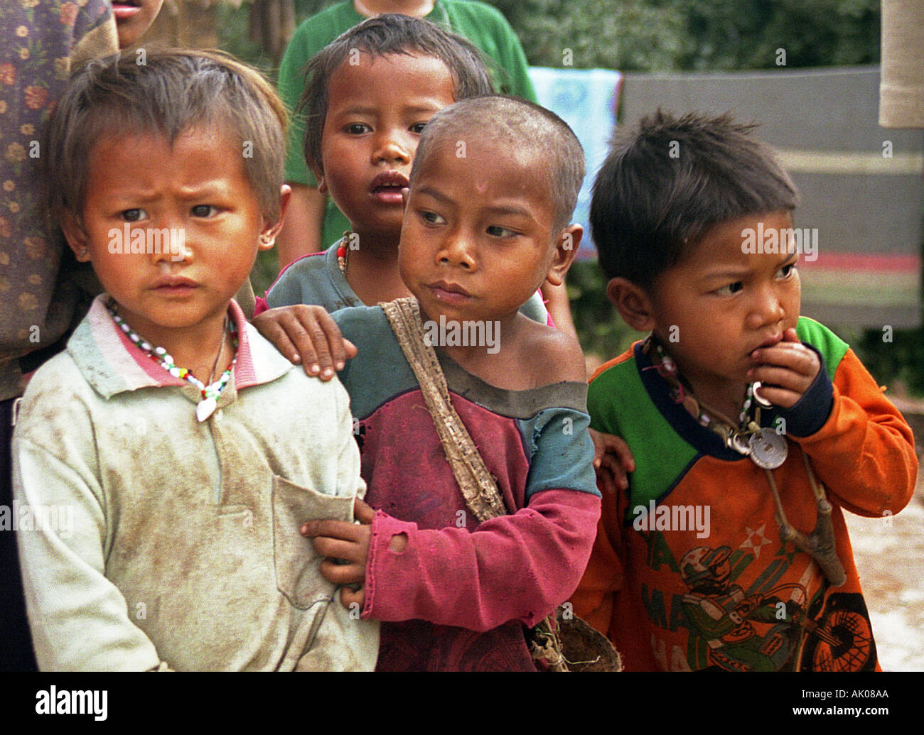 Portrait group colourful indigenous children boy girl poor shanty watch ...