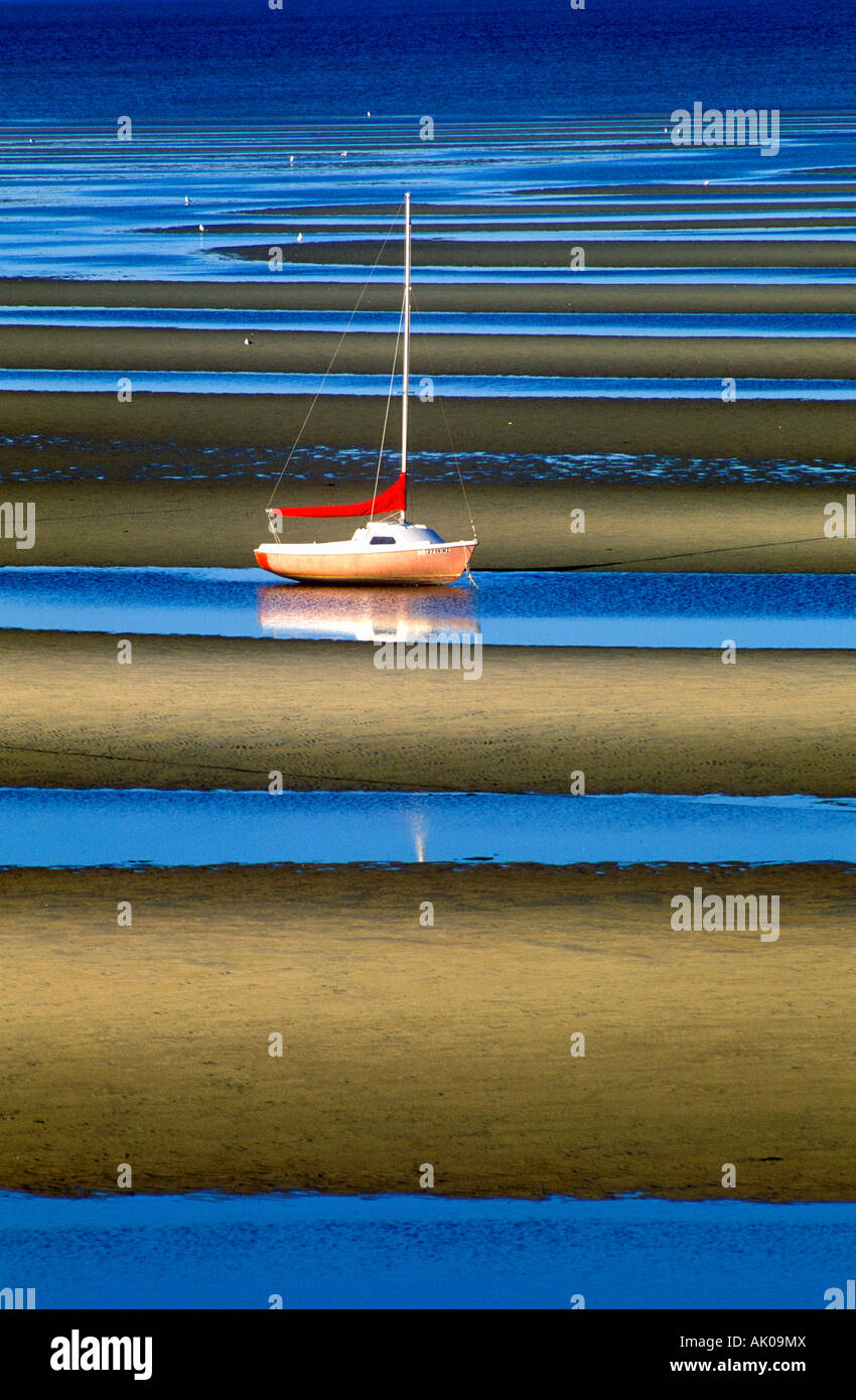 Sailboat anchored in tidal flats, Cape Cod Bay, Eastham, MA Stock Photo ...