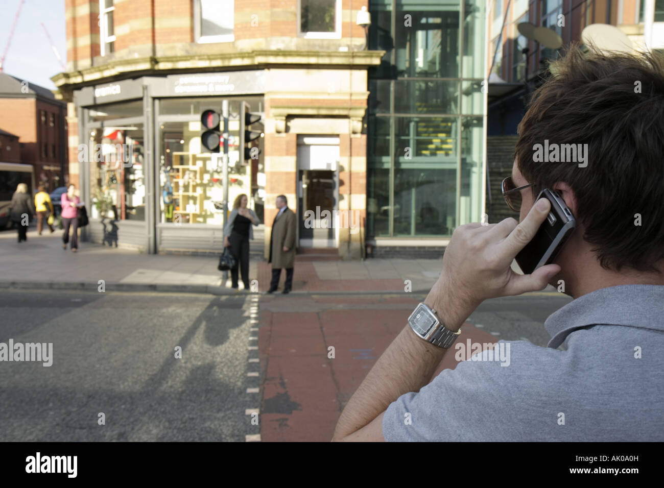 Uk group looking at phones hi-res stock photography and images - Alamy