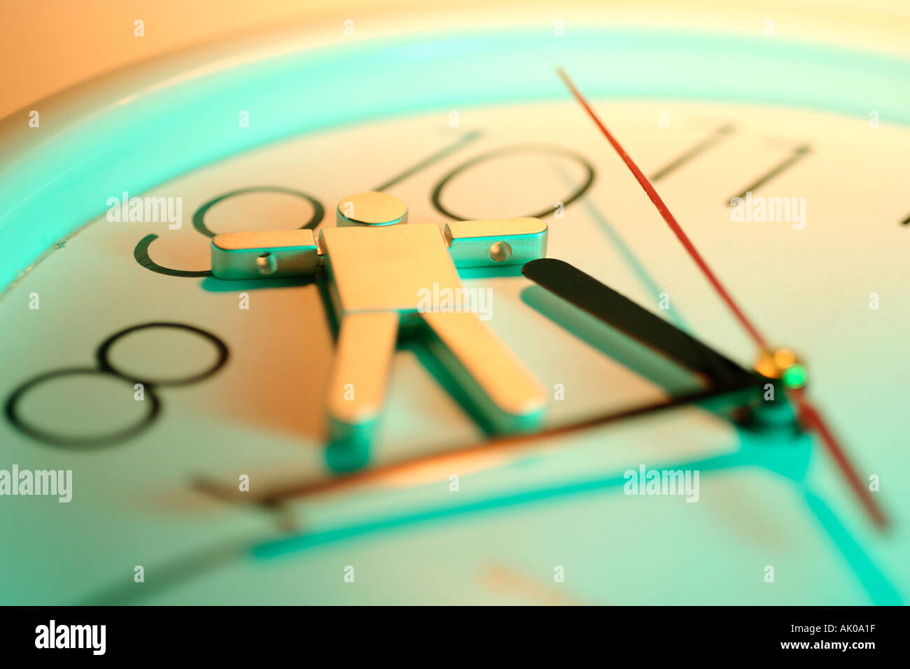 Metal Male Figure on Clock Stock Photo - Alamy