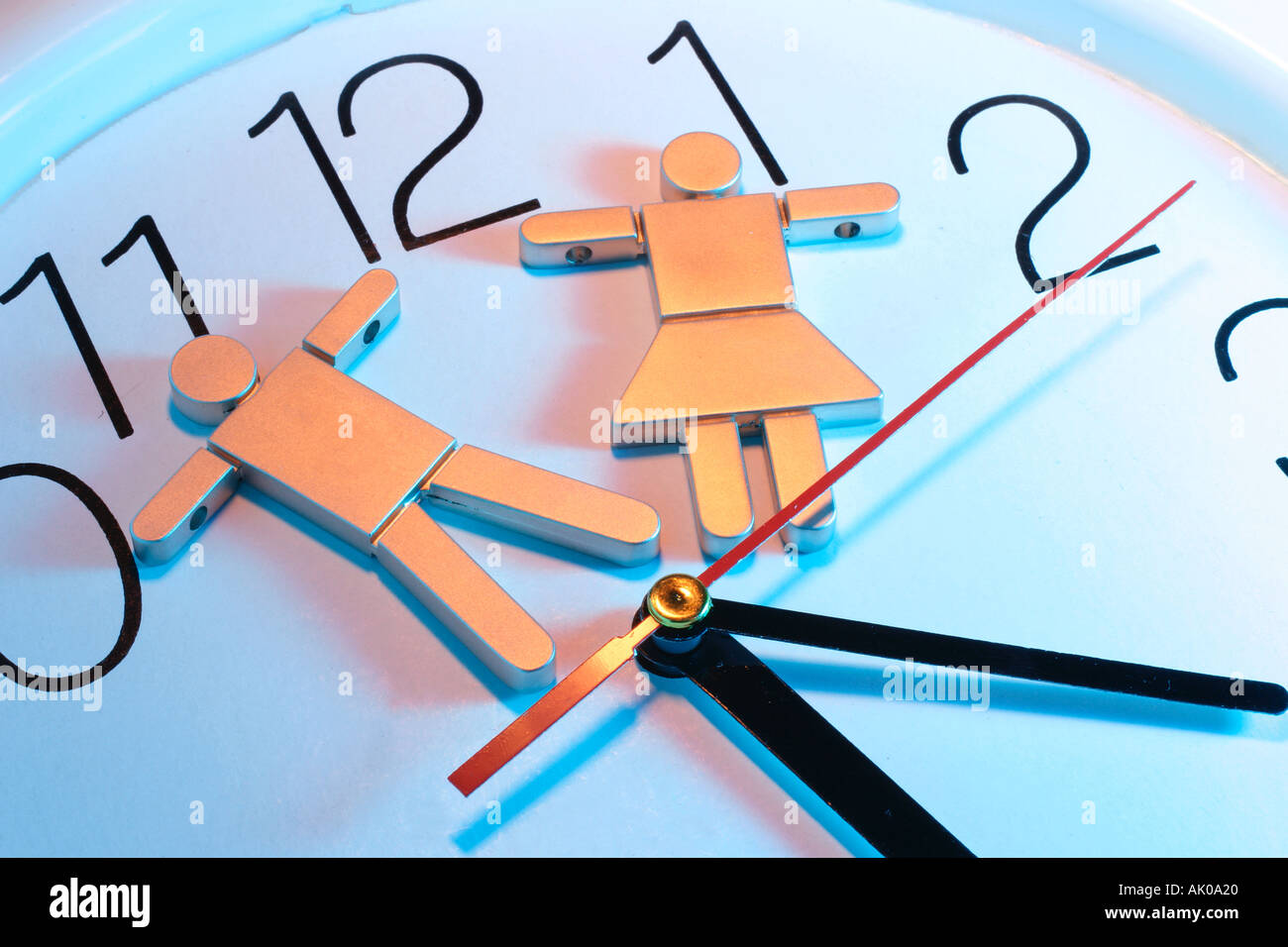 Metal Male and Female Figures on Clock Stock Photo - Alamy