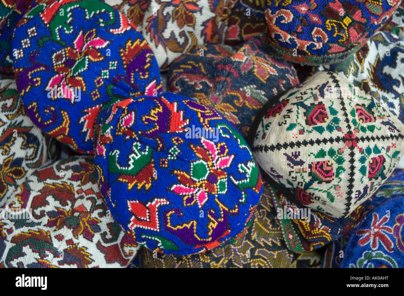 A collection of Uzbek embroidered folk hats at a bazaar in Bukhara ...