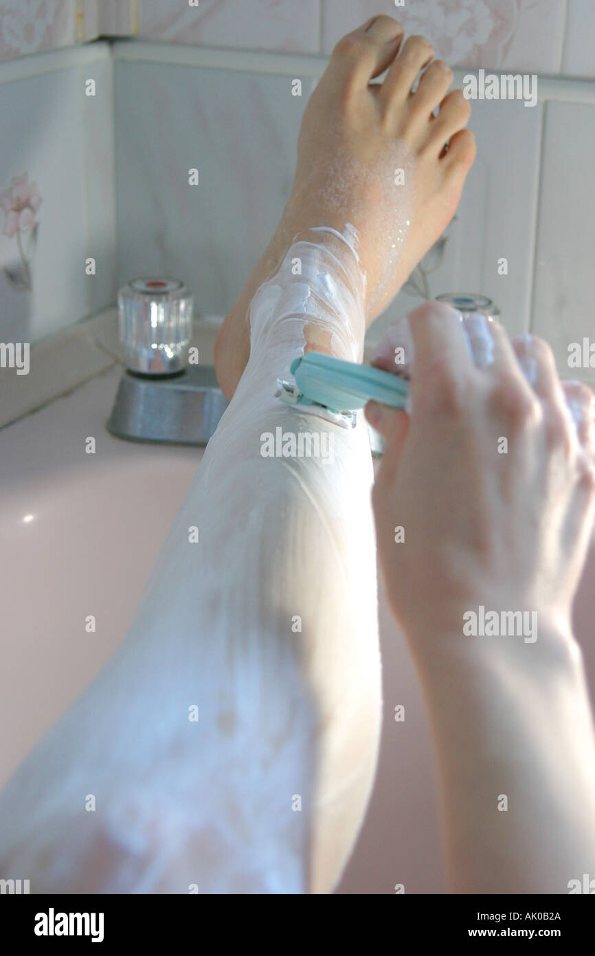 woman shaving legs Stock Photo - Alamy