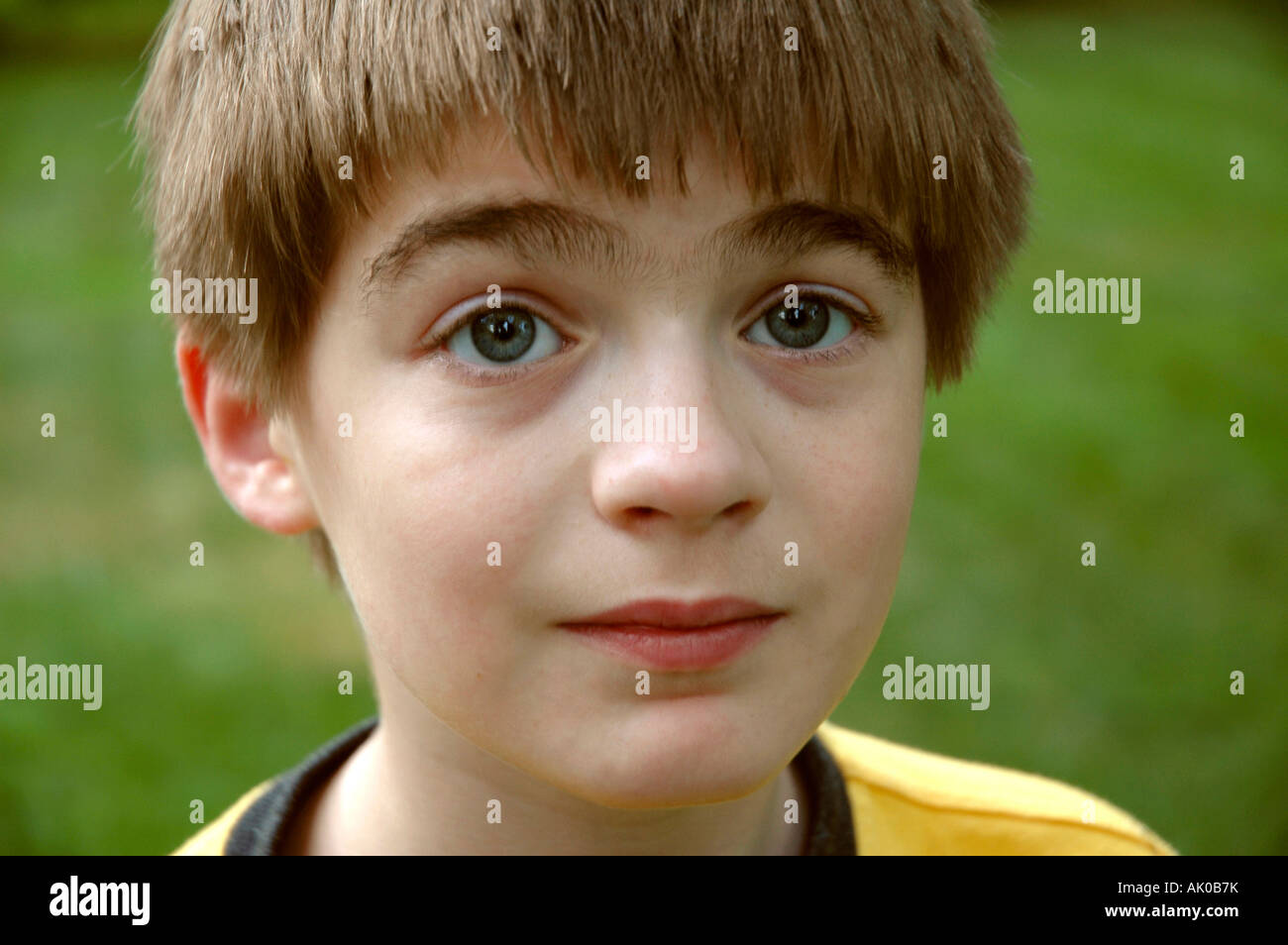 Close up of boys face with a blank expression Stock Photo - Alamy