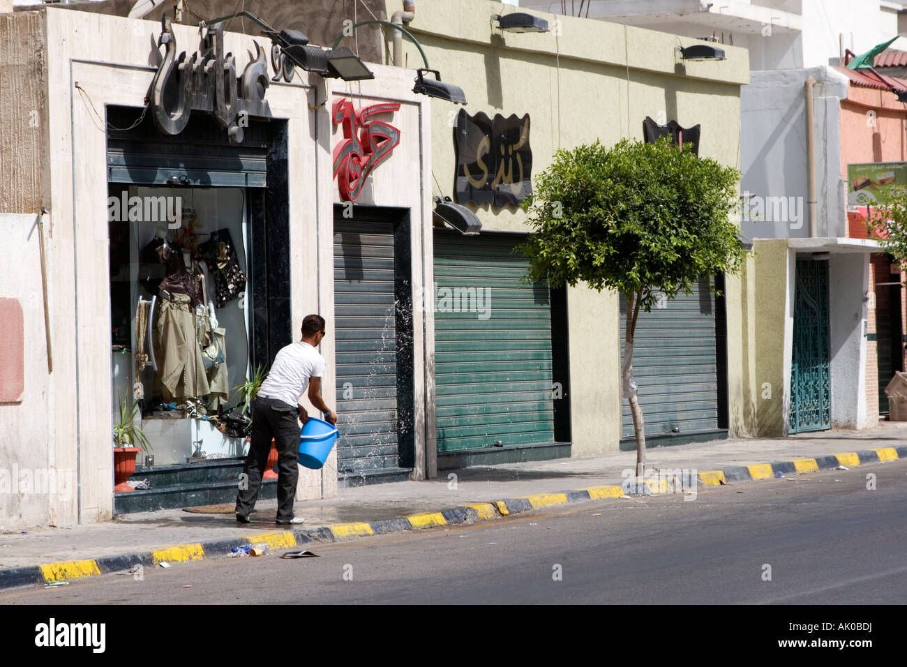 Tripoli, Libya. Street Scene, Store Front, Sidewalk Cleaning, Ben Ashour District Stock Photo ...