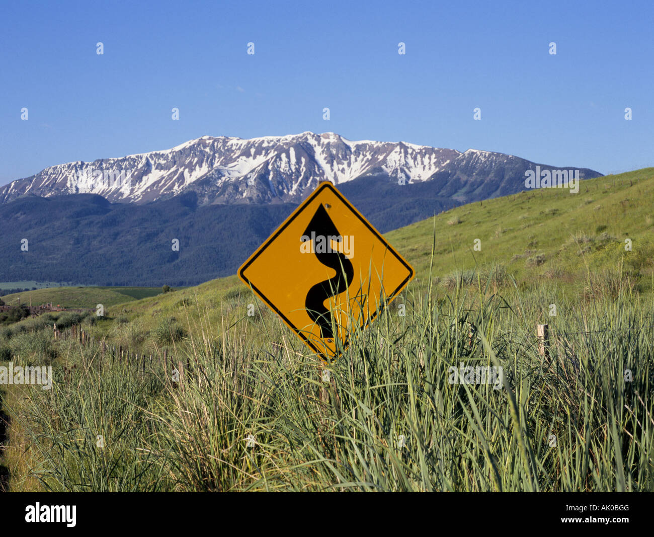 Curvy road sign with Wallowa Mountains in the background Joseph Oregon ...