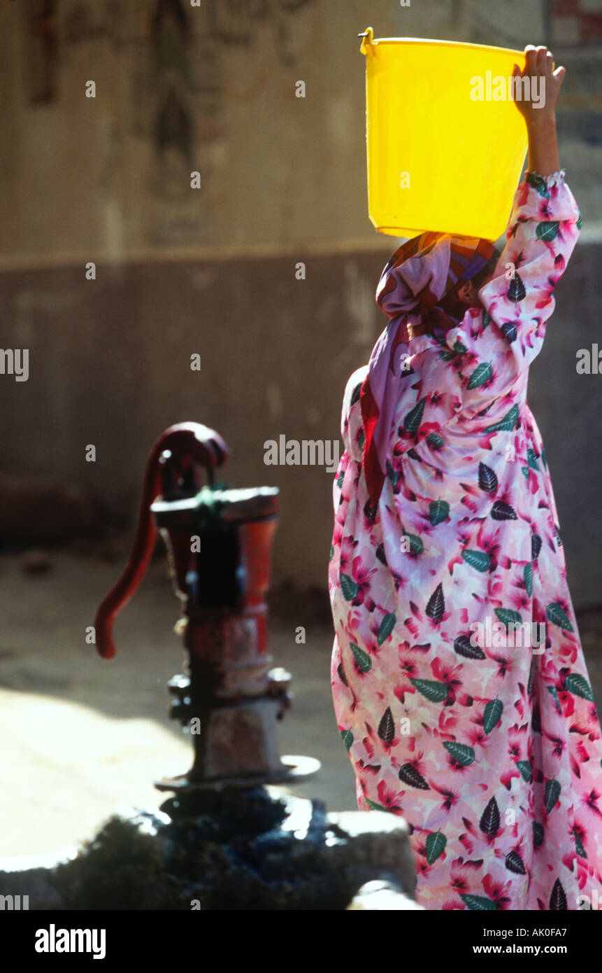 Woman fetching water from well hi-res stock photography and images - Alamy