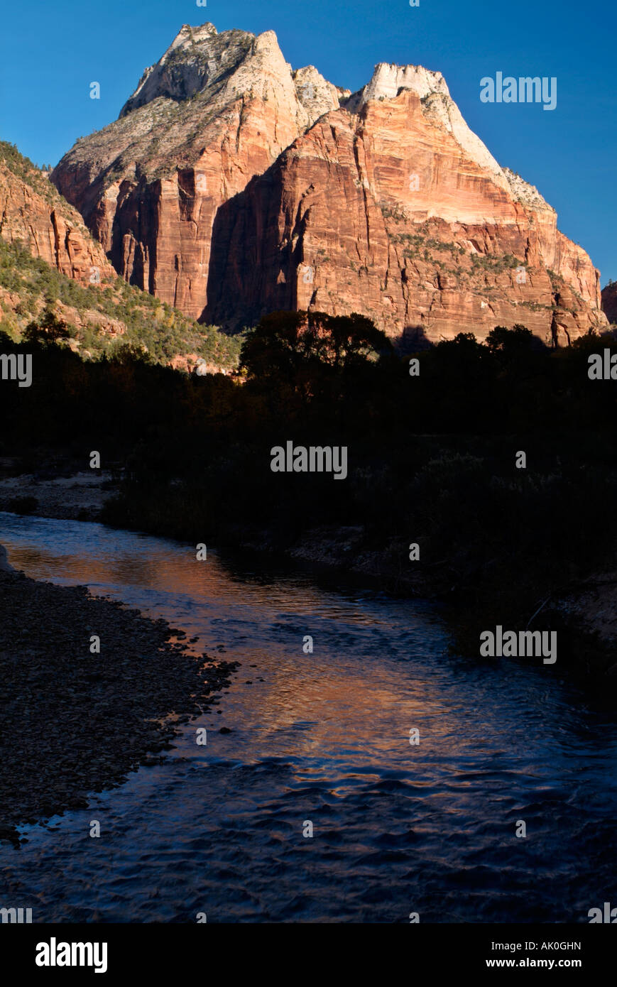 gold orange yellow and blue colours of a sandstone cliff and sky ...