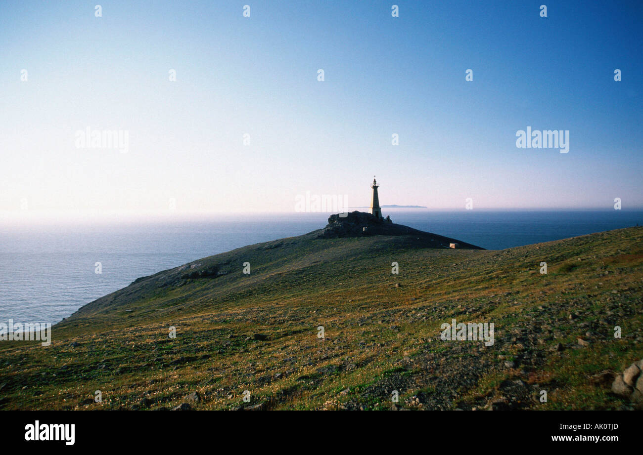 Lighthouse with monument Stock Photo - Alamy