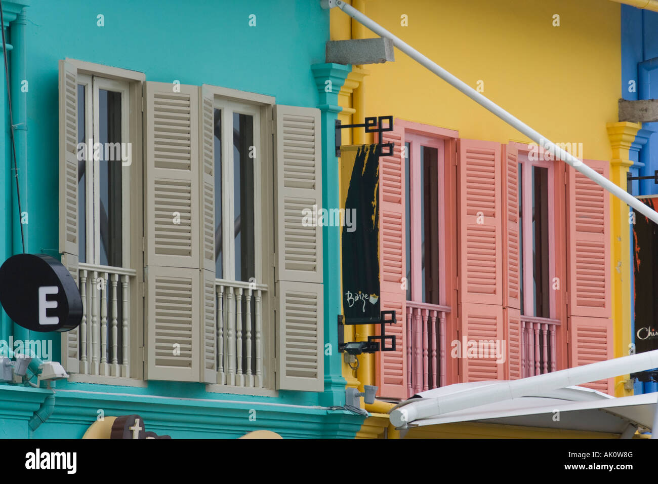 Colourful window shutters on restored traditional Chinese buildings on ...