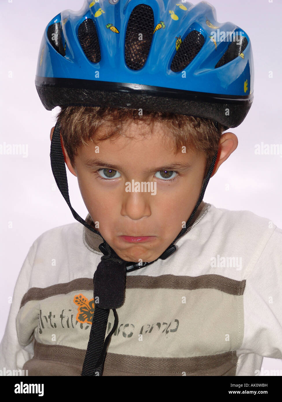 A portret of a young boy wearing a helmet Stock Photo - Alamy