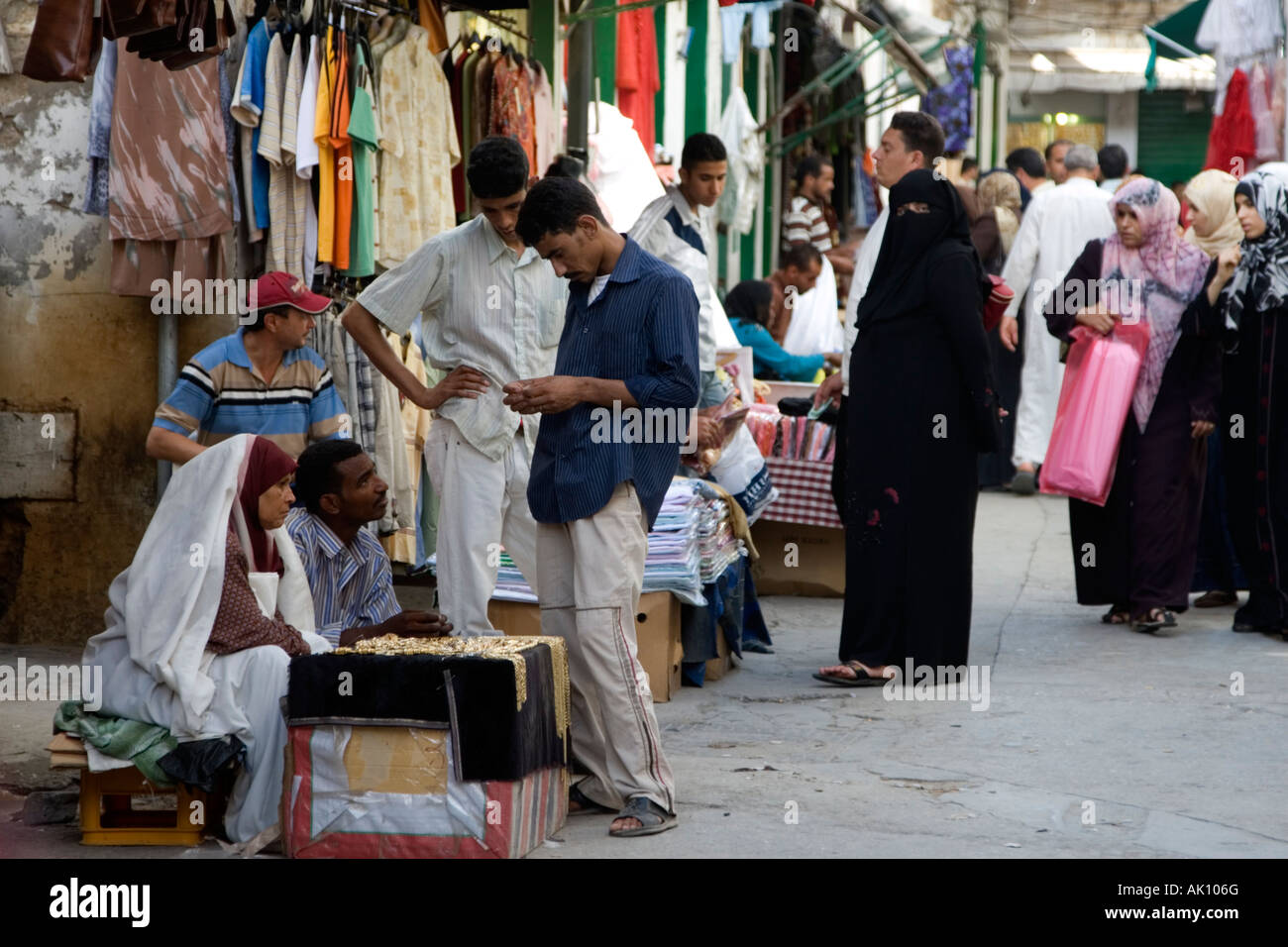 Tripoli, Libya. Medina Street Scene Man Shopping for Jewelry, Woman in Veil Stock Photo - Alamy