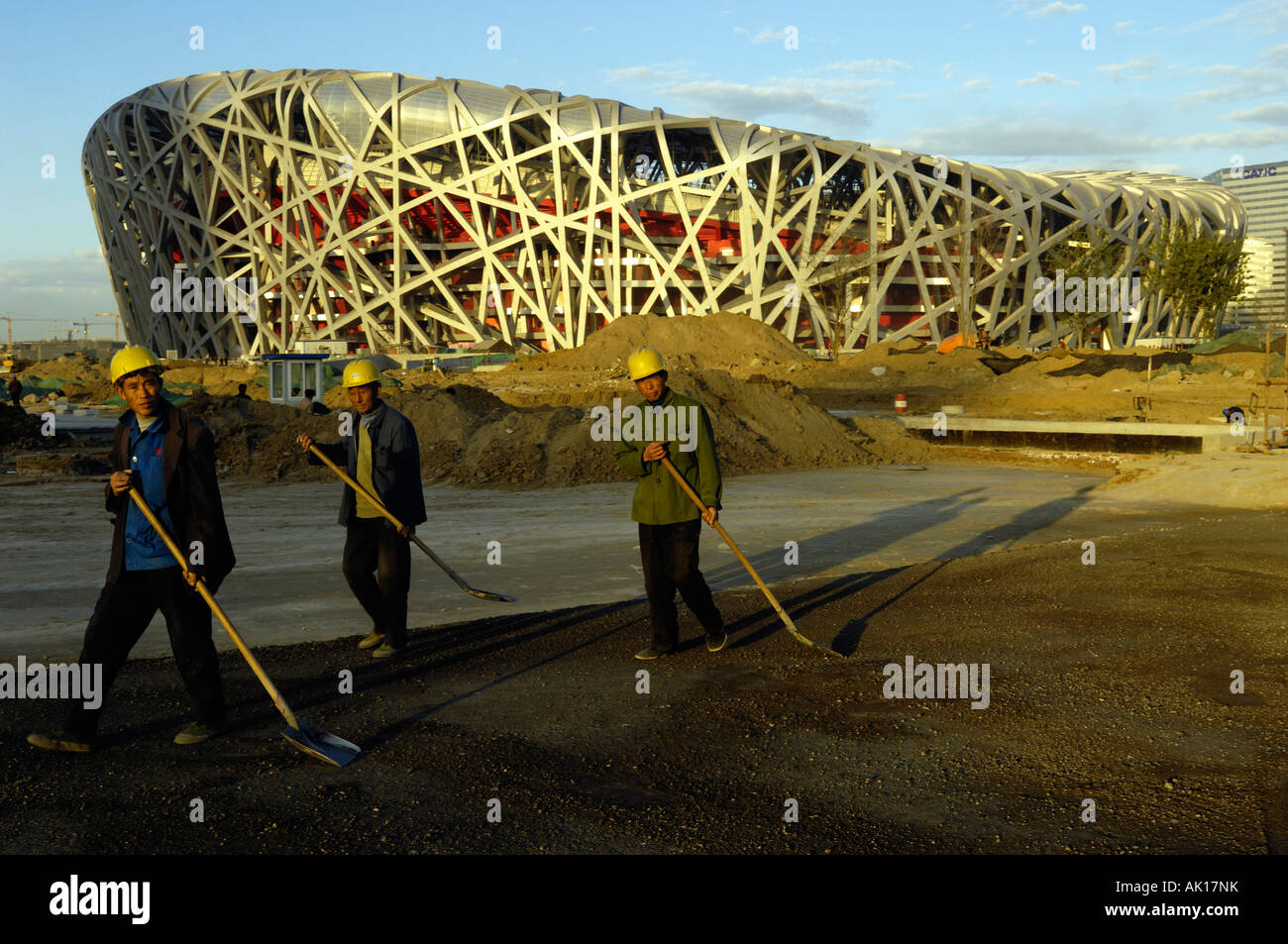 Chinese men work at the construction site of the National Stadium for ...