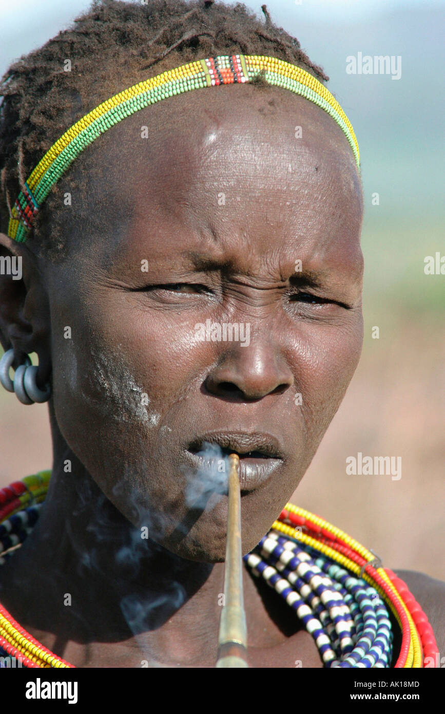 Toposa woman smoking pipe hi-res stock photography and images - Alamy