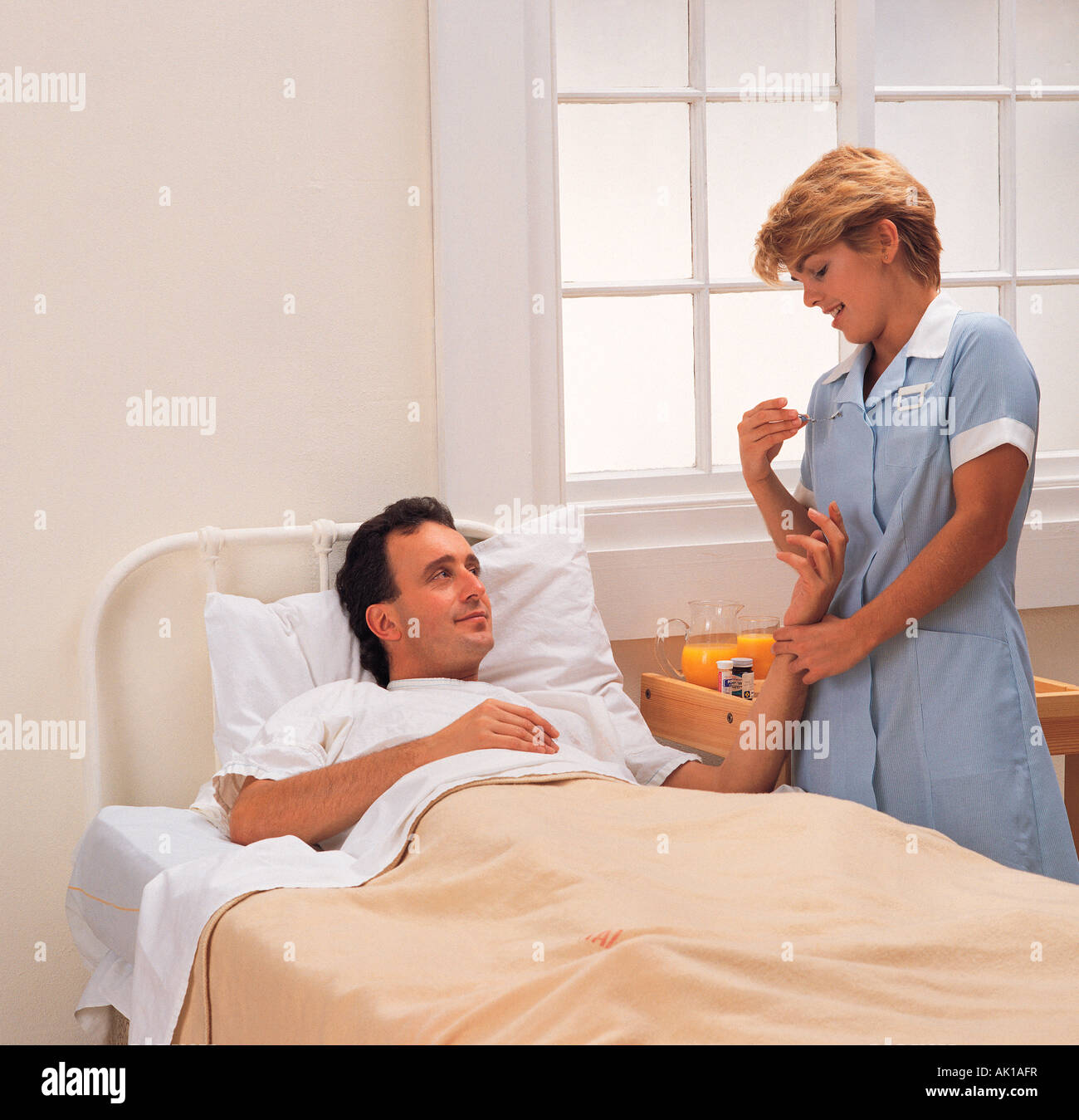 Hospital. Male patient with nurse Stock Photo - Alamy