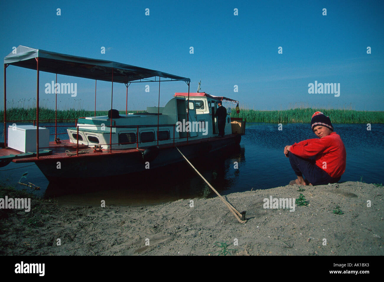 Boy at bank / Letea / Junge am Ufer Stock Photo - Alamy