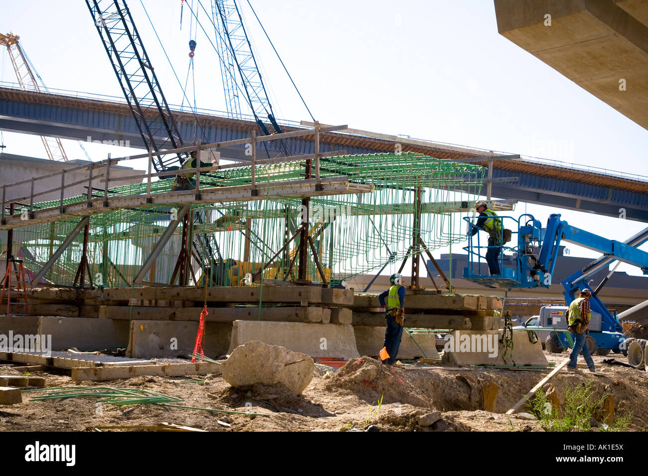 workmen at the site of the Marquette interchange project overpass ...