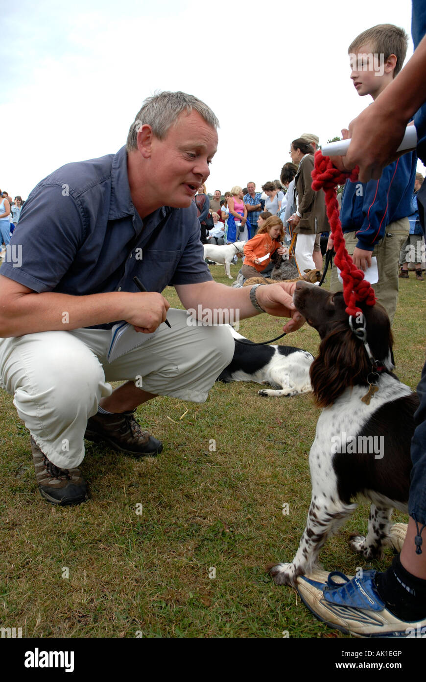 Martin Clunes judging a dog show at a village fete in Dorset, Britain ...