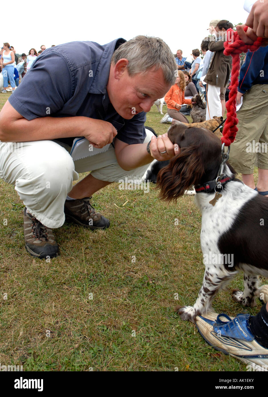 Martin Clunes judging a dog show at a village fete in Dorset, Britain ...