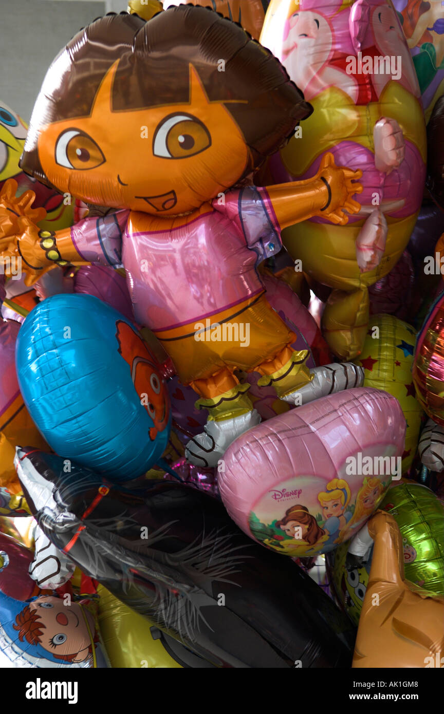Colourful helium character balloons Stock Photo - Alamy