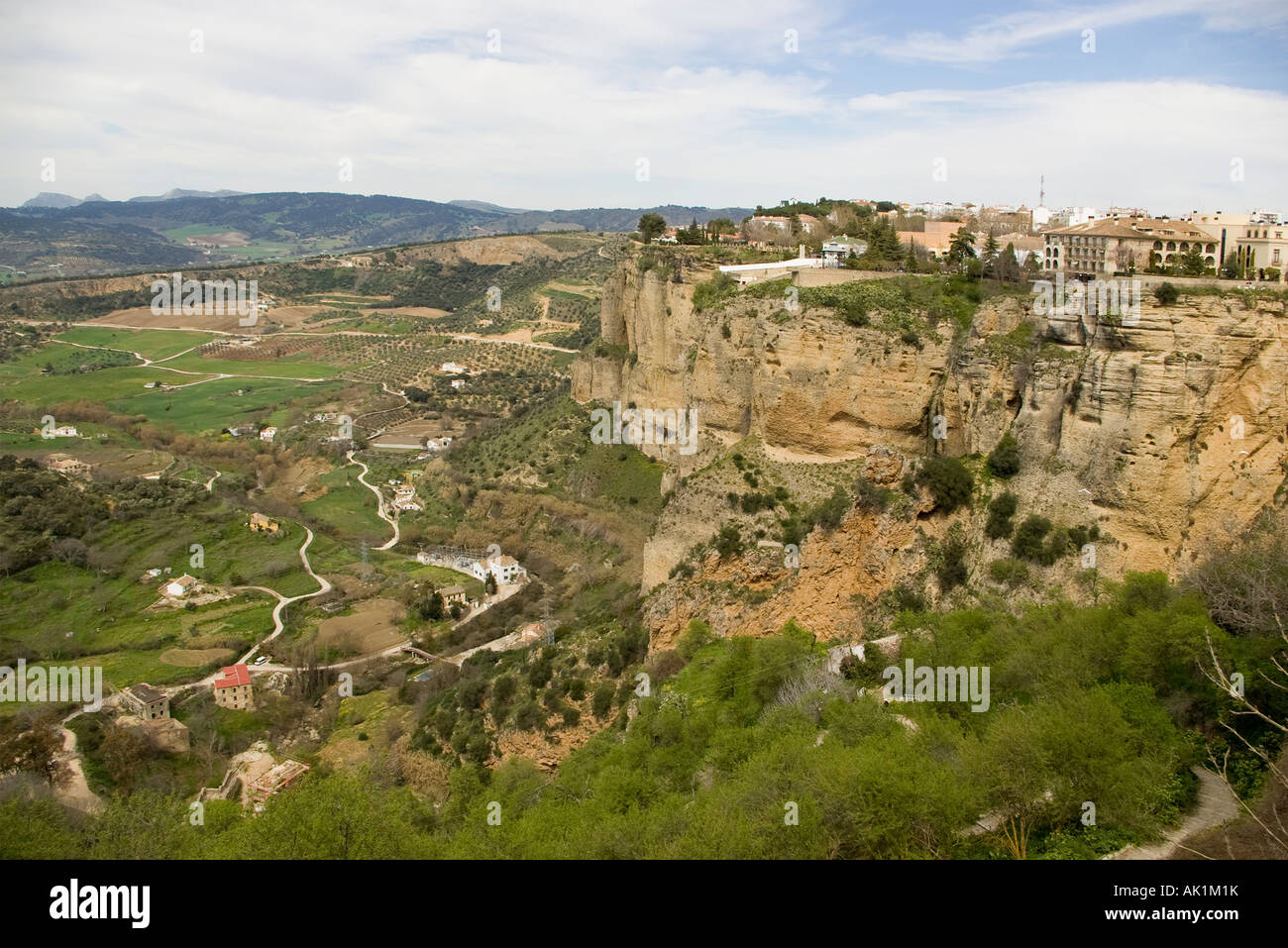 View of the steep cliff that protects the western edge of Ronda, Spain ...