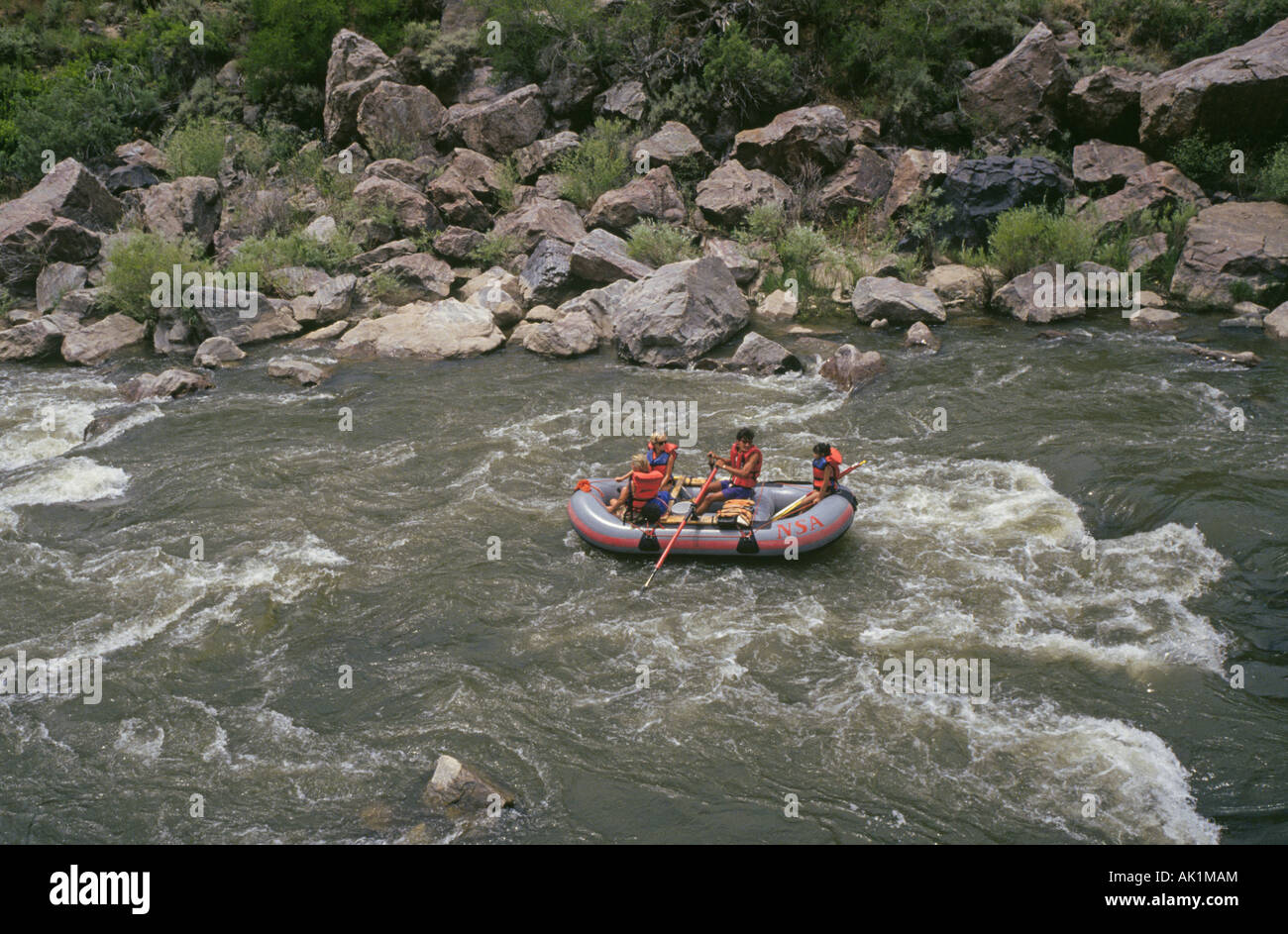 Visitors ride the rapids of the Rio Grande in the upper Rio Grande ...