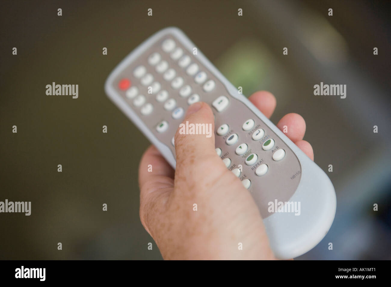 hand with remote control Stock Photo - Alamy